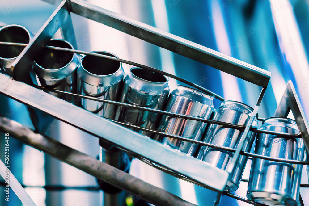 Conveyor belt with tin beer cans. Automated production of beer beverage ...