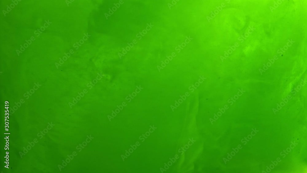 Paint fall into water which is twist. Spin acrylic ink drip into liquid ...