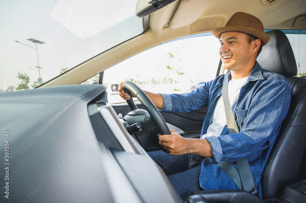 Asian men are driving carefully. And smile happily with this trip Stock ...