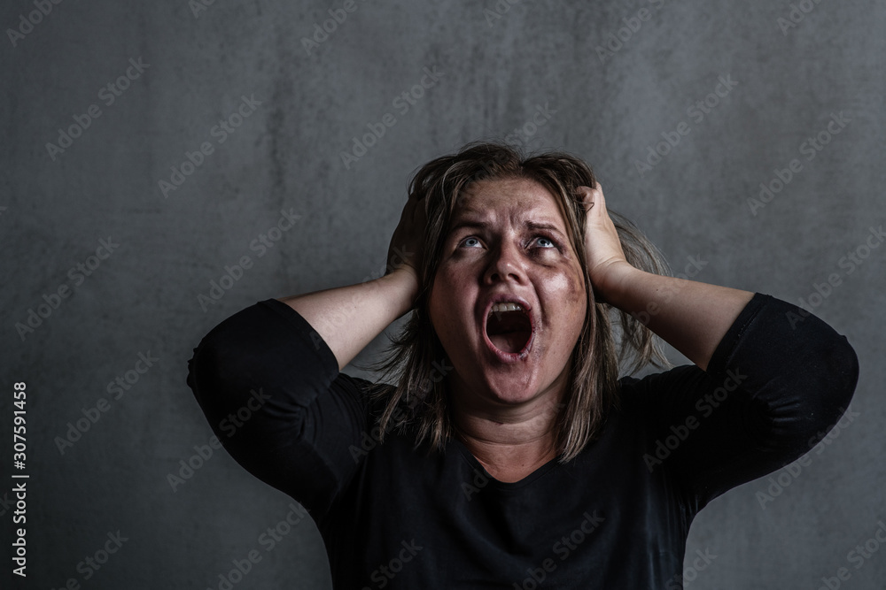 Angry young woman victim of domestic violence and abuse having nervous ...