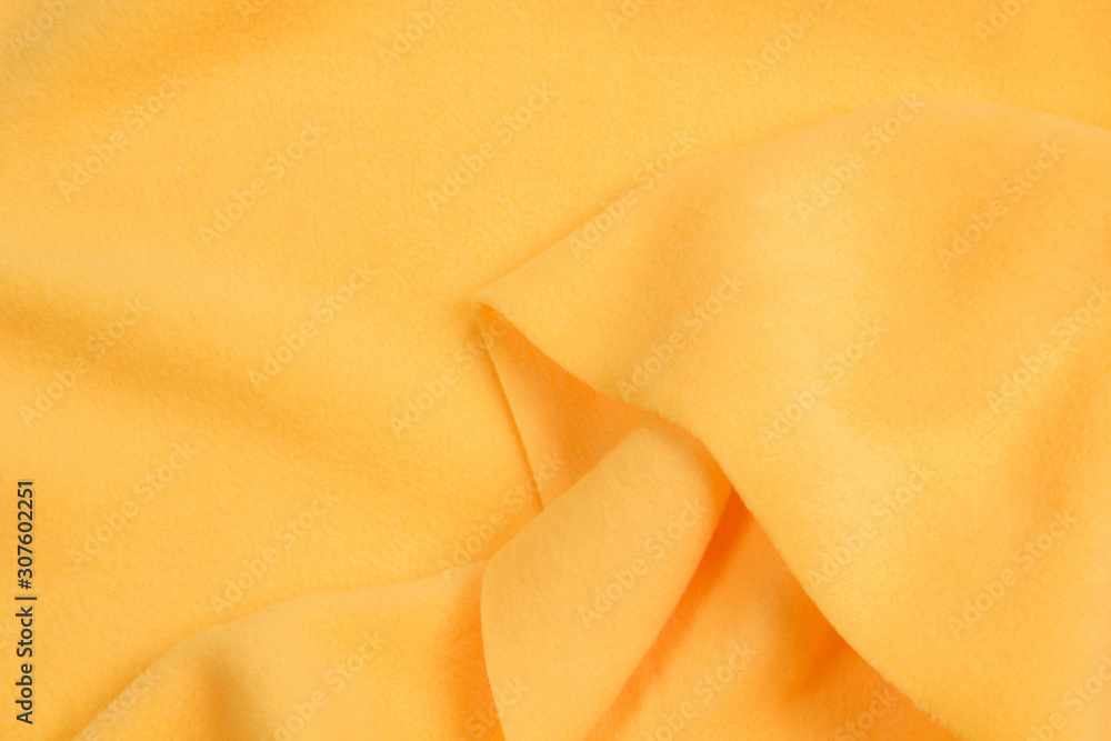 Fleece fabric yellow top view. Texture of textile fleece bedspread ...