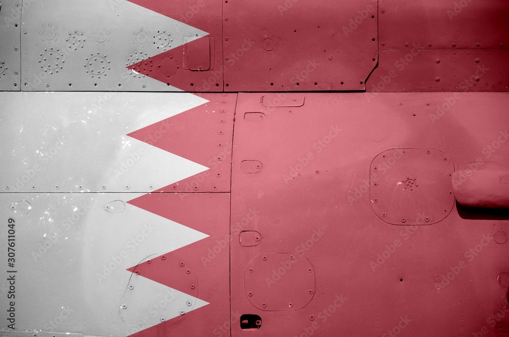 Bahrain flag depicted on side part of military armored helicopter ...