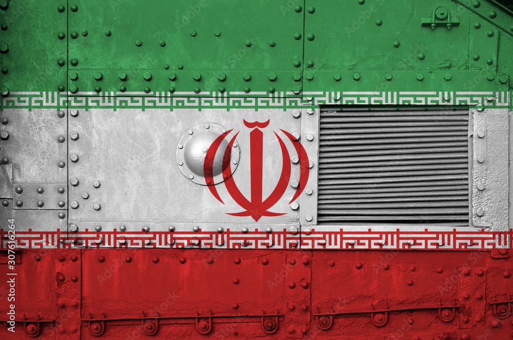 Iran flag depicted on side part of military armored tank closeup. Army ...