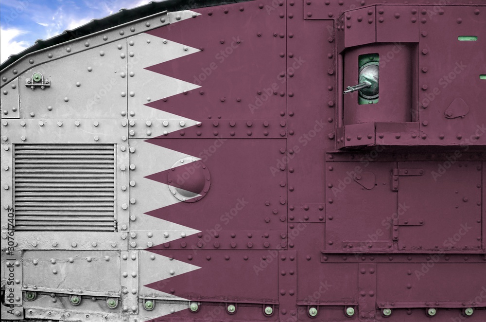 Qatar flag depicted on side part of military armored tank closeup. Army ...
