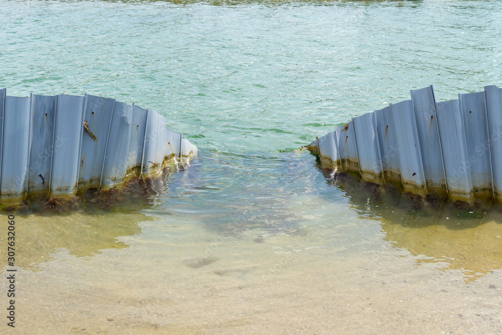 Sheet pile retaining wall on a sea shore. Recycled plastic in use ...