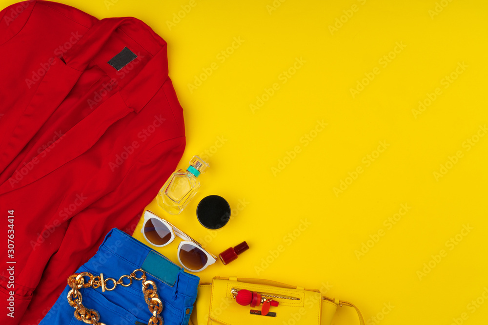 Trendy woman outfit with accessories on bright yellow background Stock ...