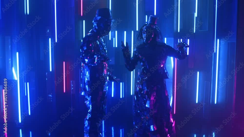 Neon light couple metallic shiny couple dancing together. Modern glass ...