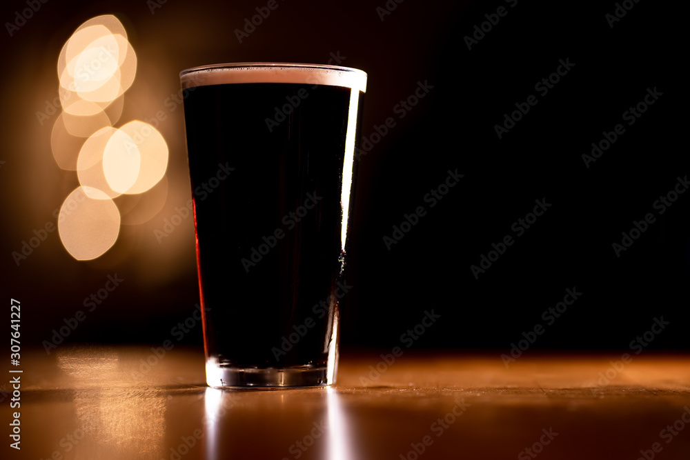 Pint of Dark Stout Beer on a Wooden Table with Copy Space Stock Photo ...