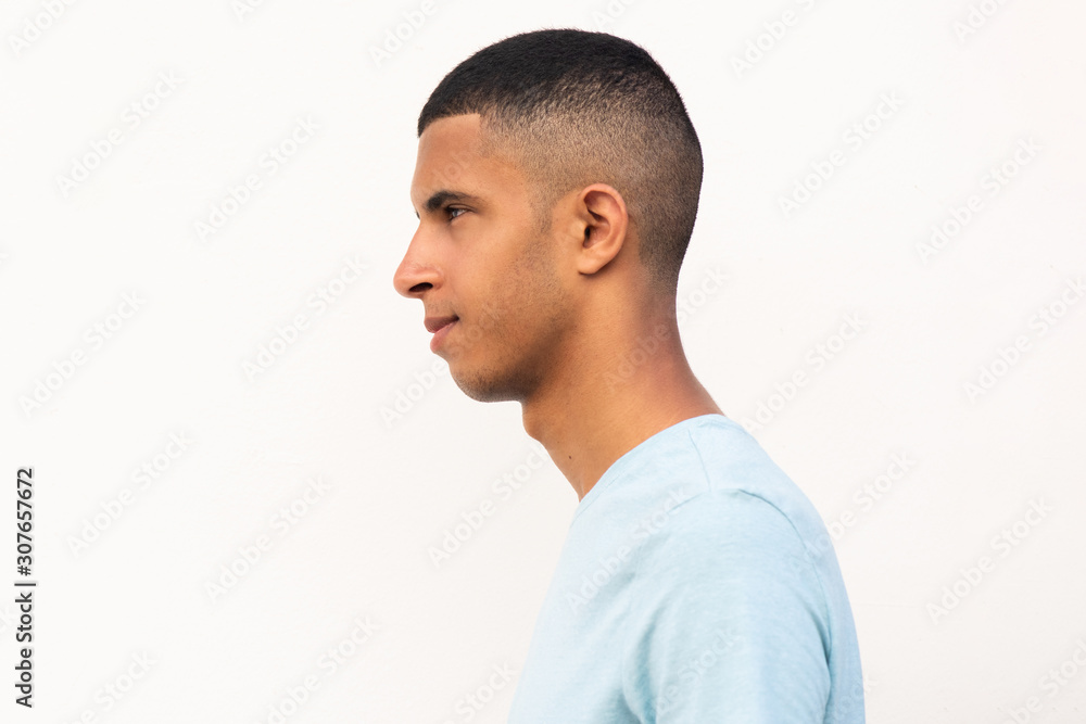 Profile of young North African man with serious expression by isolated ...
