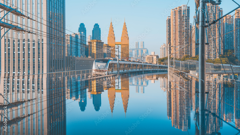 Photo & Art Print Light rail platform and high-rise buildings in ...