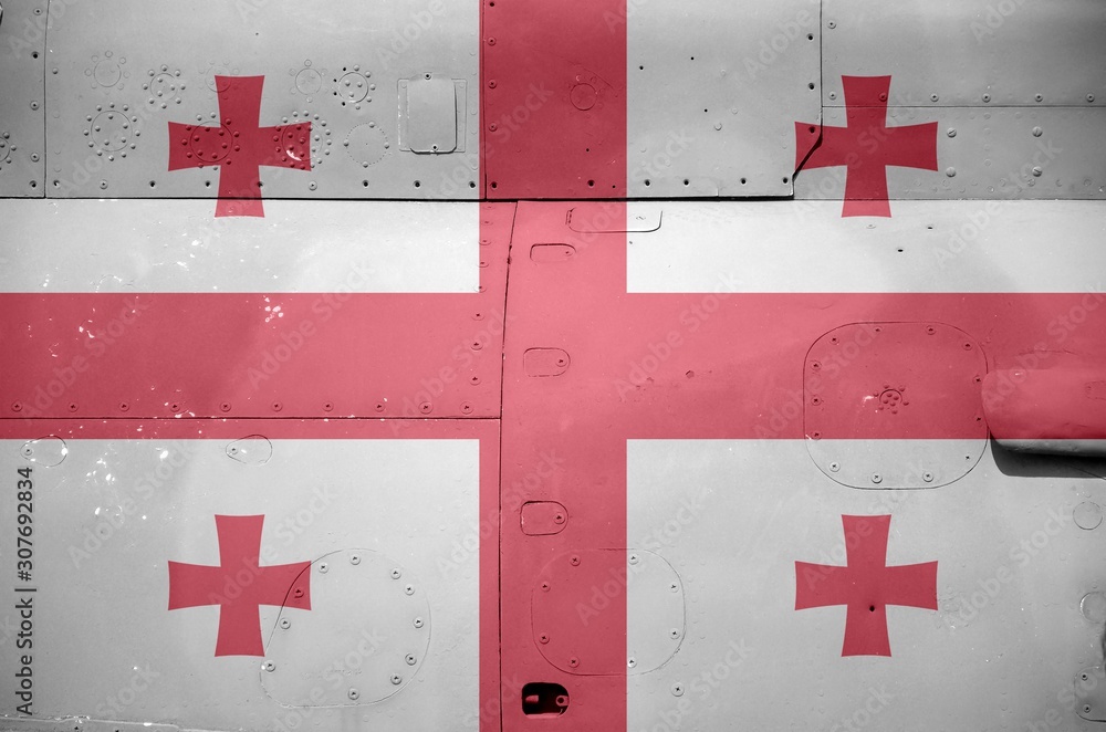 Georgia flag depicted on side part of military armored helicopter ...
