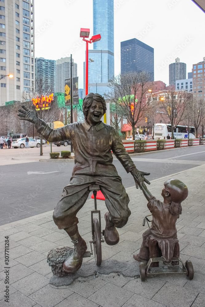 bronze statue of Ronald MacDonald and a small girl outside of McDonalds ...