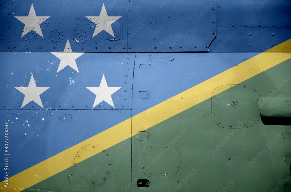 Solomon Islands flag depicted on side part of military armored ...