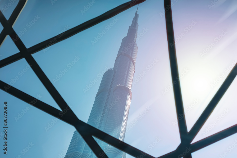 Skyscraper in Dubai. Burj Khalifa Tower. View through constructions ...