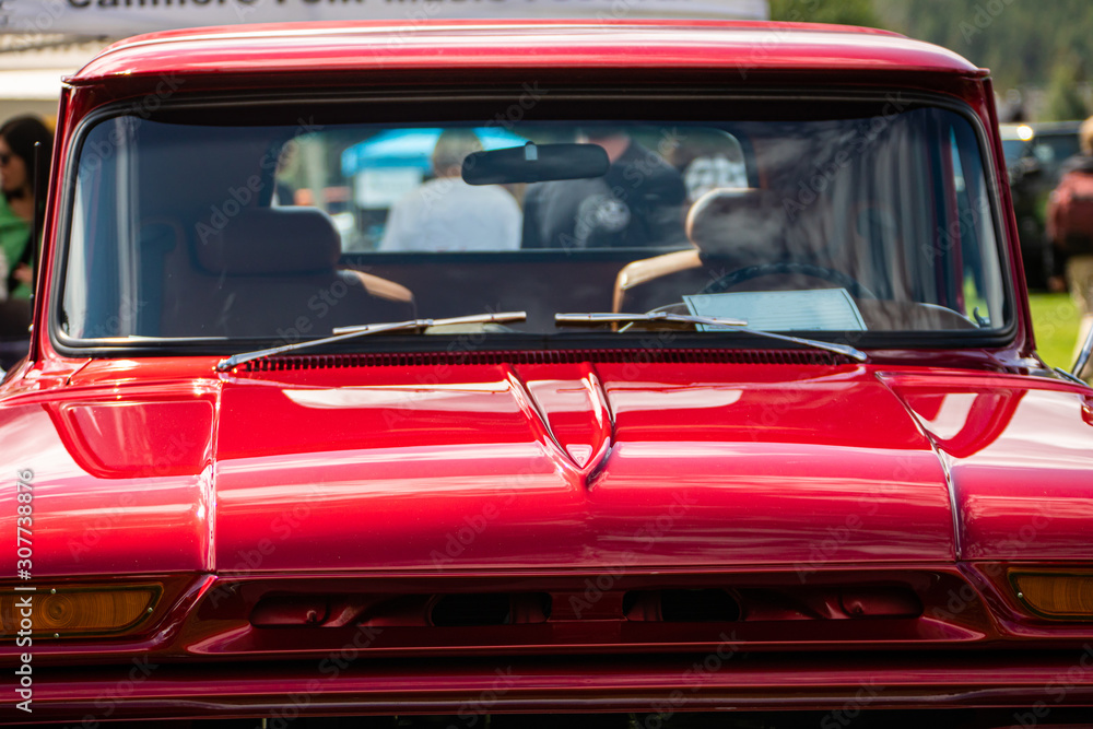 old classic antique American red car front, view of the windscreen ...