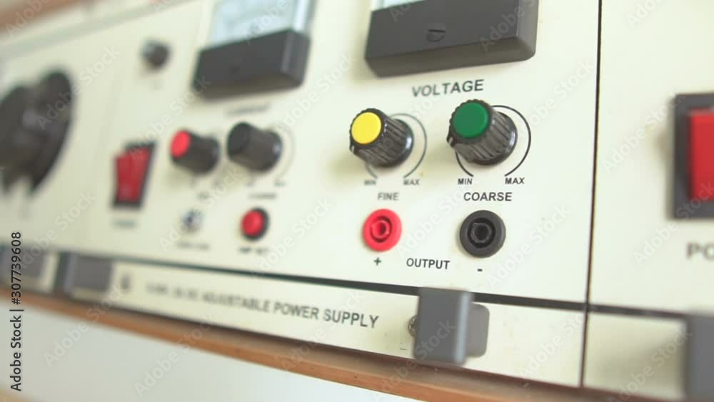 slow motion dolly shot of function generator in electric lab and stop ...