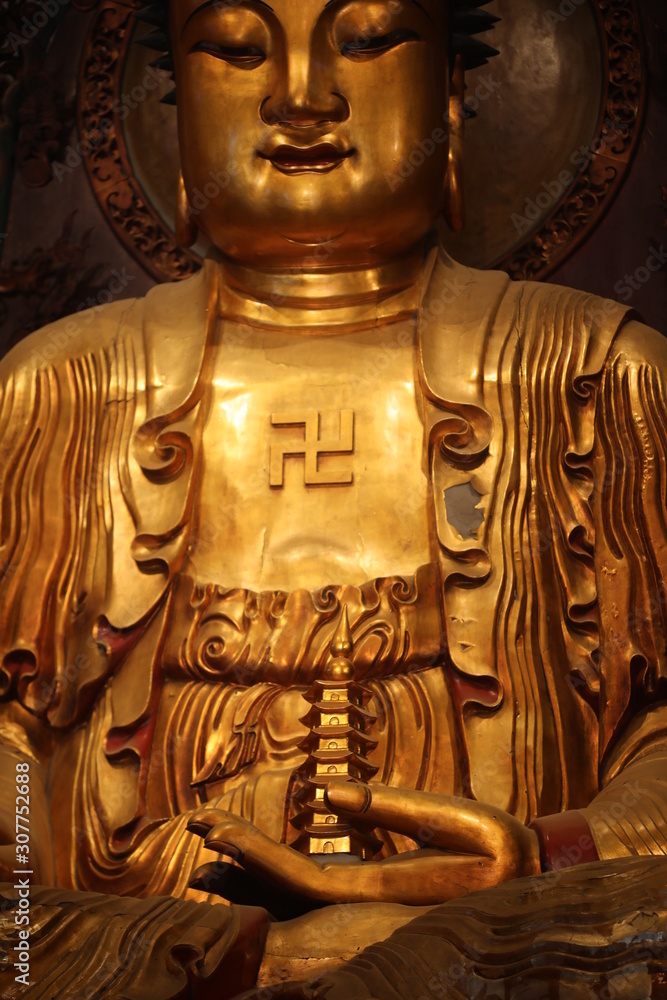 Buddha with the symbol of the swastikaIn. Buddhism, the swastika is ...