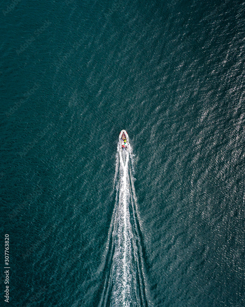 Birds-eye view of boat flying through frame Stock Photo | Adobe Stock