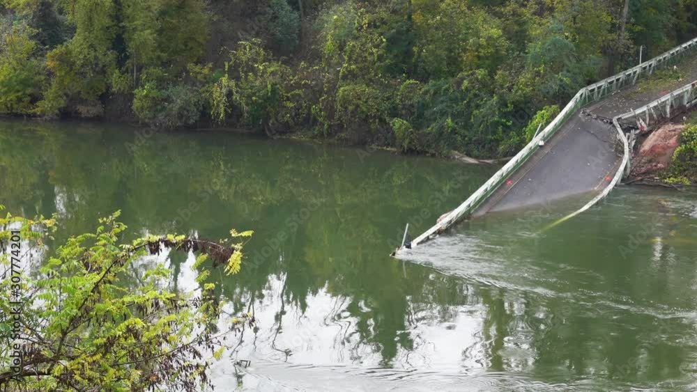 Broken metal bridge beetween two shores . The remains of the bridge ...