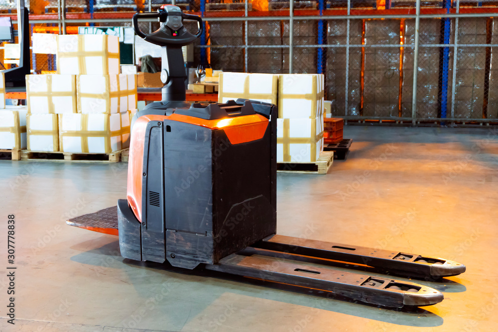 Electric forklift pallet jack with stack package boxes on pallets at ...