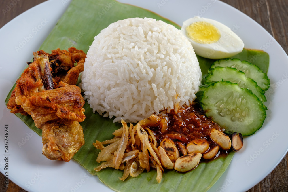 Nasi lemak rice with chicken, egg, peanut, anchovies and sambal. famous ...