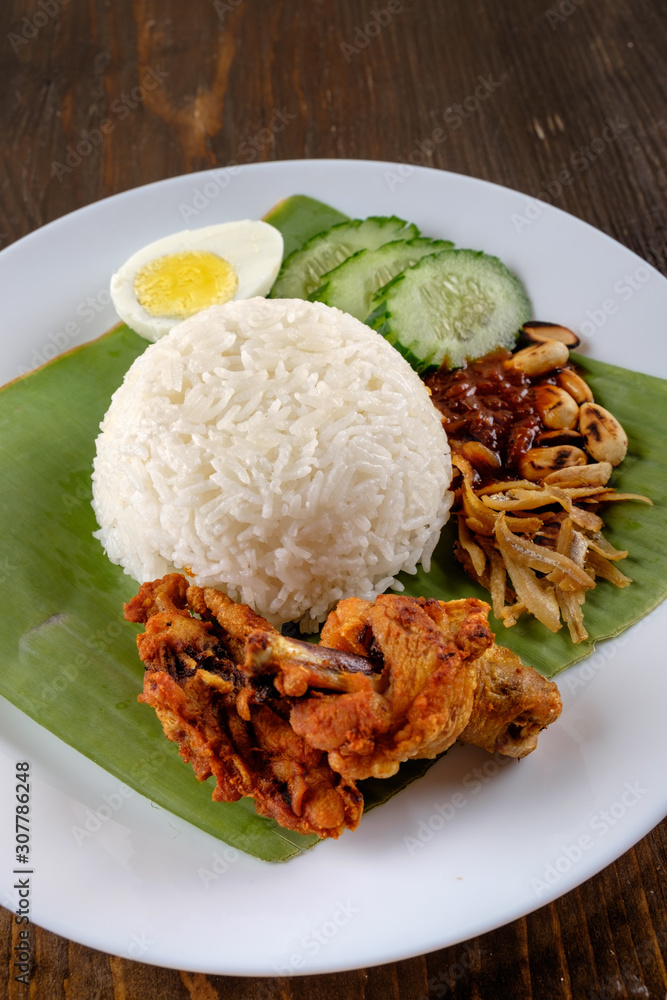 Nasi lemak rice with chicken, egg, peanut, anchovies and sambal. famous ...