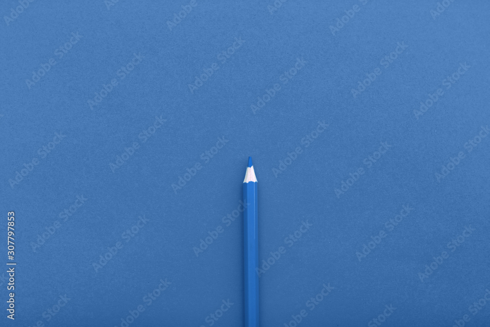 One blue pencil on a classic blue background, minimalism, background ...