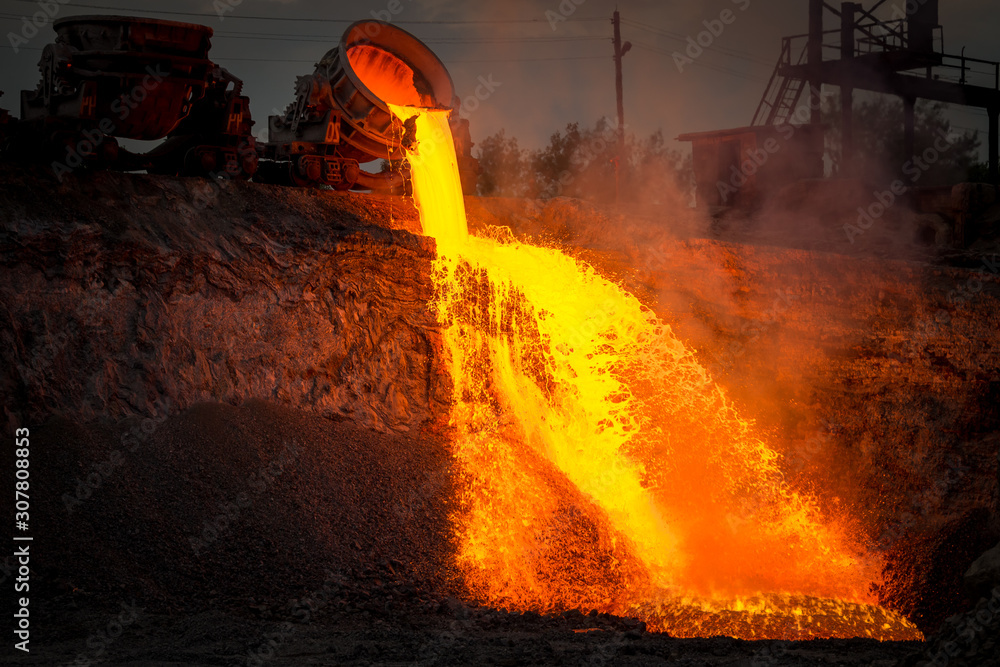 Discharge of metallurgical slag from blast furnaces. Beautiful stream ...