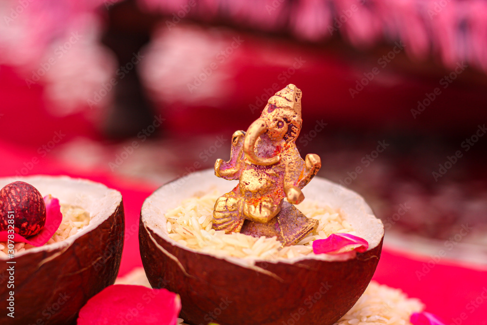 Dry coconut and lord Ganesha sculpture Stock Photo | Adobe Stock