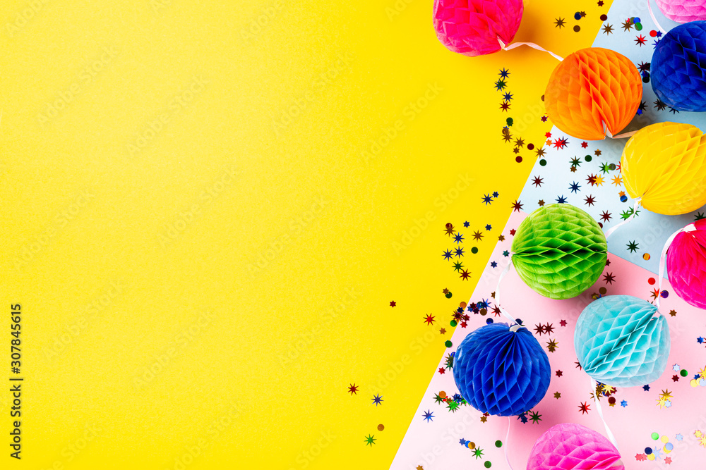 Festive yellow background with colorful paper balls. Greeting card ...