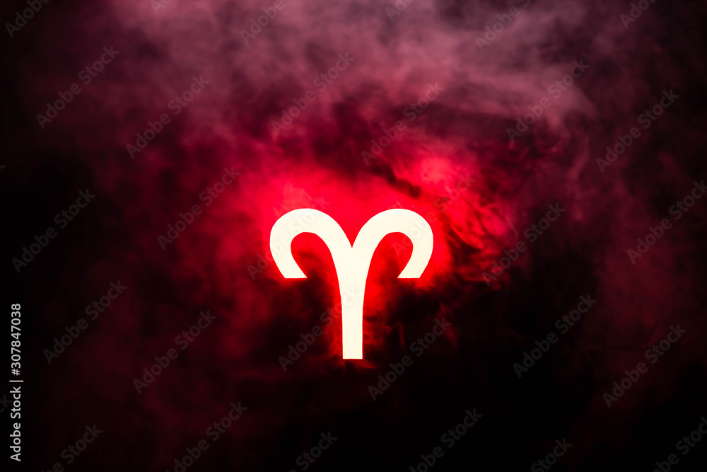 red illuminated Aries zodiac sign with smoke on background Stock Photo ...