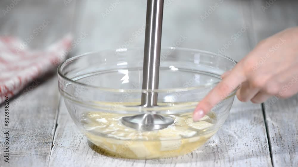 Pastry chef blend liquid ingredients, making mirror glaze. Stock-Video ...