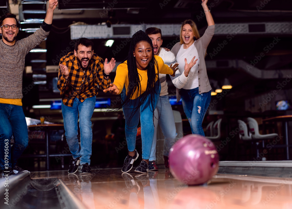 Group of friends enjoying time together laughing and cheering while ...