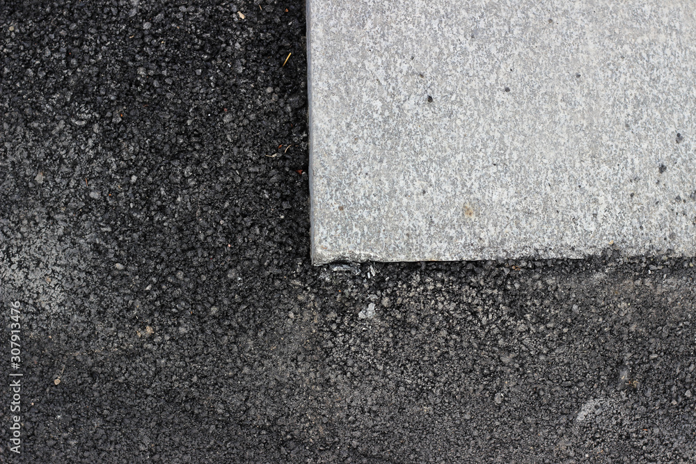 Dark new asphalt surface surrounding marble tile detail texture Stock ...