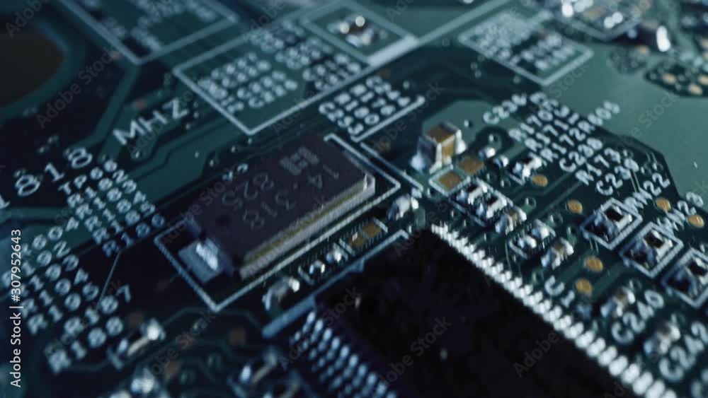 Macro Camera Moving Slowly over Printed Circuit Board, showing Computer Motherboard Components ...