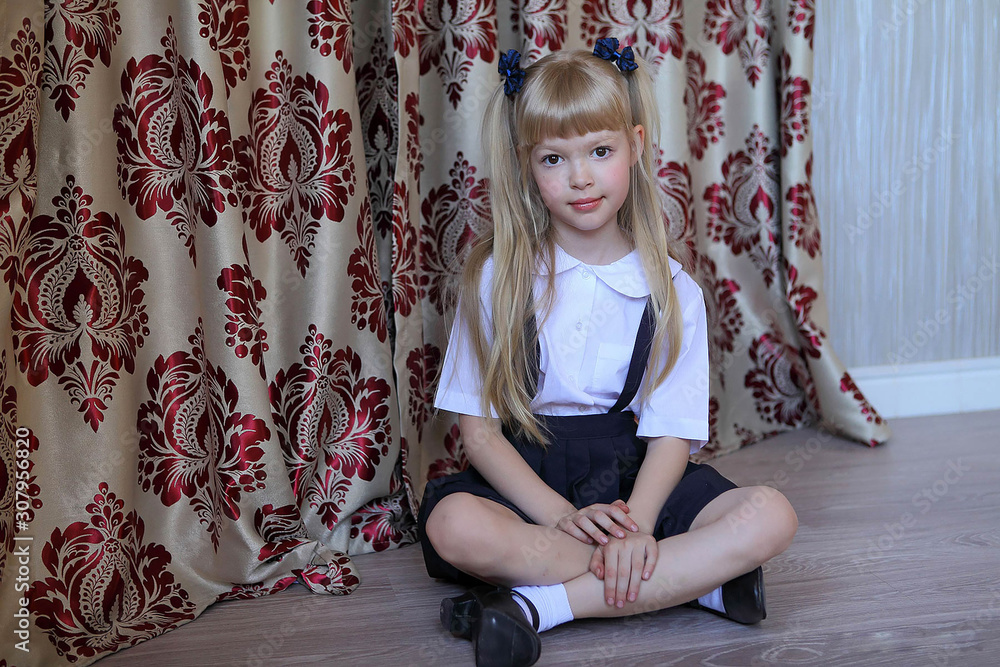 Nice cute sweet tender cheerful positive small little girl with curly ...