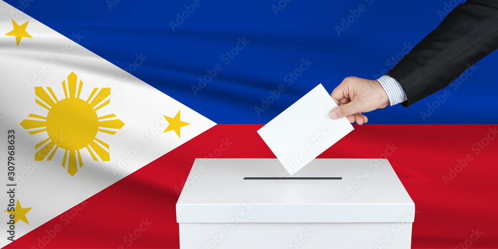 Election in Philippines. The hand of man putting his vote in the ballot ...