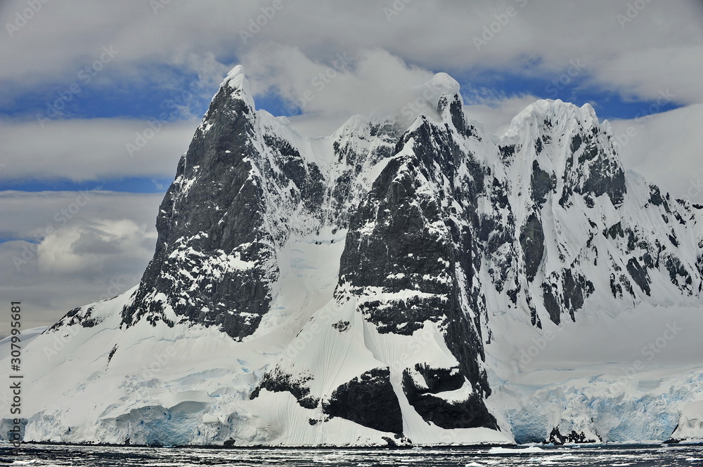 The majestic and harsh nature of Antarctica. Mountains covered by ice ...