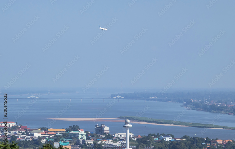 Aerial landscape view above Mukdahan city with Ho Kaeo tower of ...