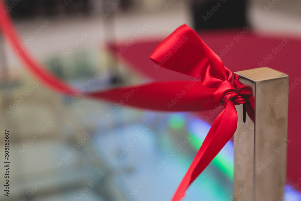 Process of cutting the red ribbon during the grand opening of the new ...