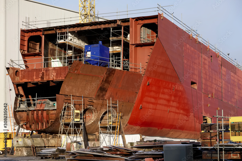 Ship building yard at shipbuilding construction dock with scaffolding ...