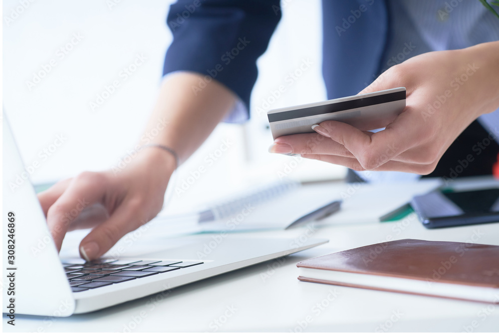 Businesswoman inputting her password and login to carry out online ...