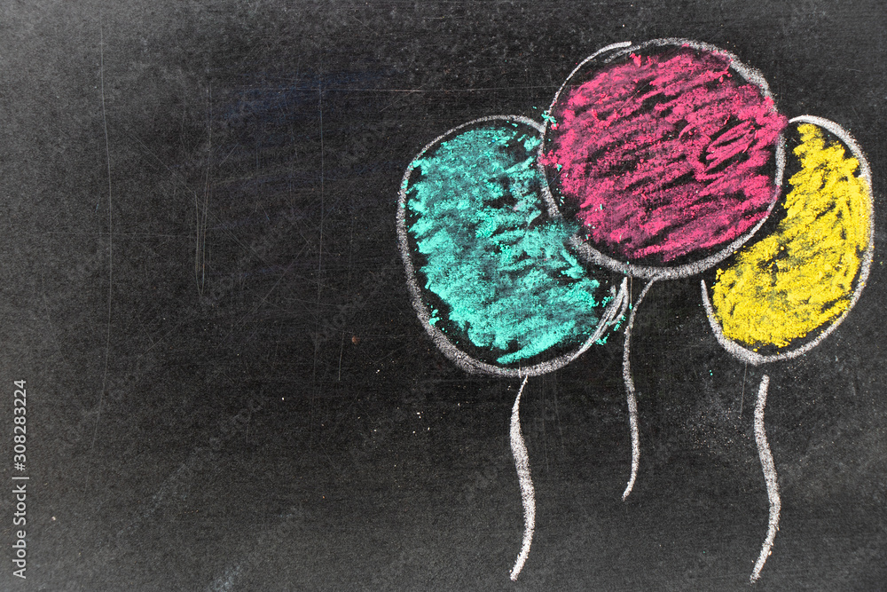 Color chalk hand drawing in balloon shape on blackboard background with ...