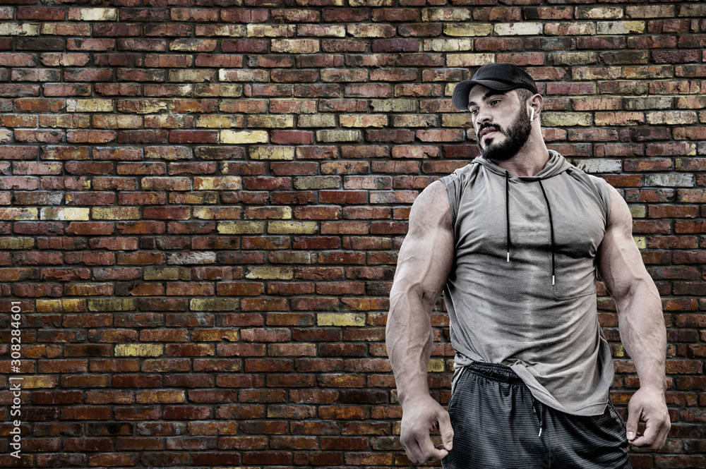 powerful strong young bearded caucasian muscle man in sport hoodie ...
