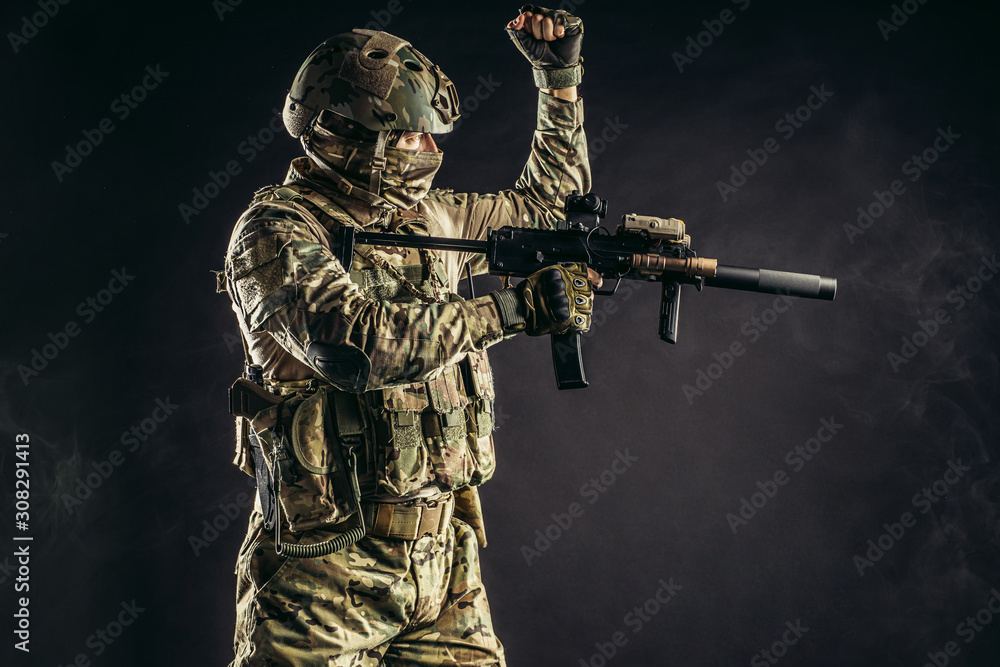 young soldier of russian military forces stand in smoky foggy space ...