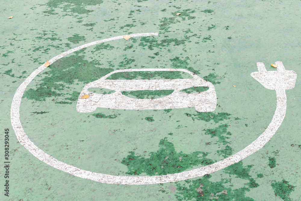 A close-up sign of an electric vehicle cars charging at the station ...