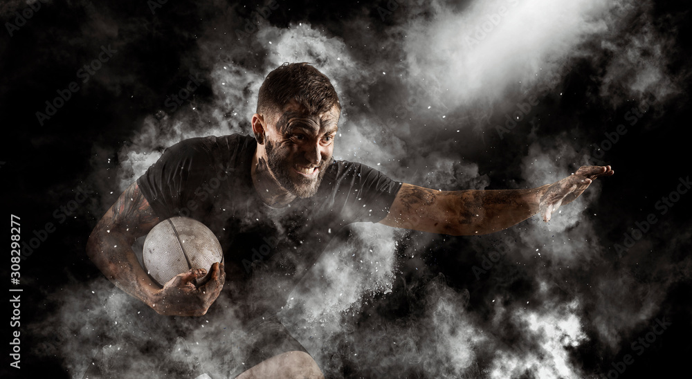 Handsome rugby player in action Stock Photo | Adobe Stock