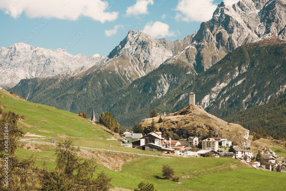 Ardez, a typical eastern Swiss village with Alps and Steinsberg castle ...