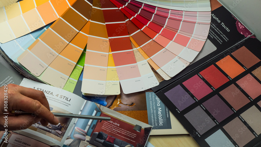 Foto de Designer who chooses colors with a color palette chooses a ...