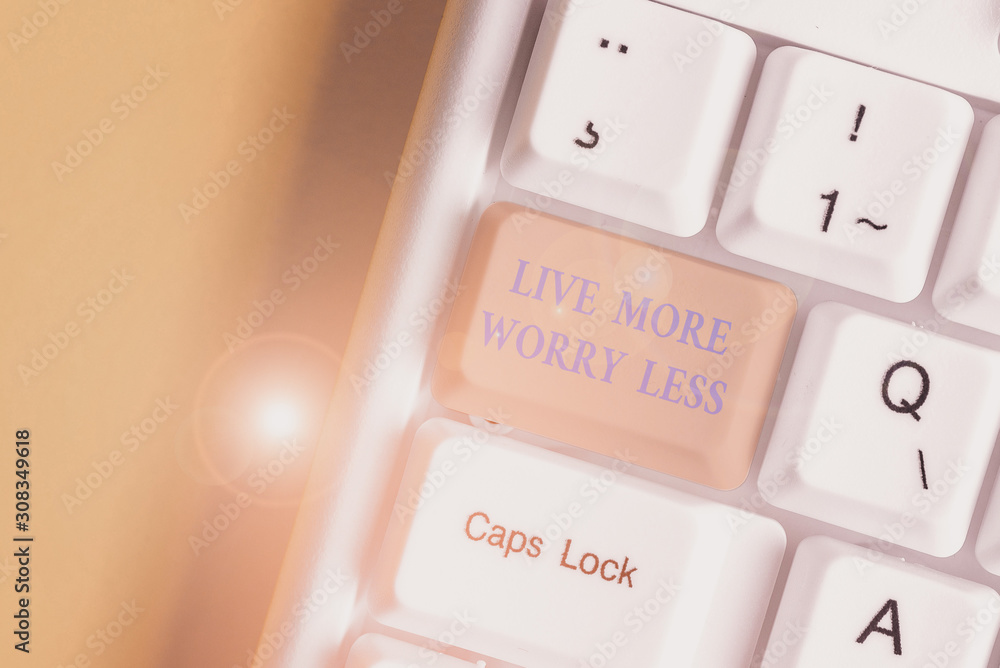 Writing note showing Live More Worry Less. Business concept for Have a ...
